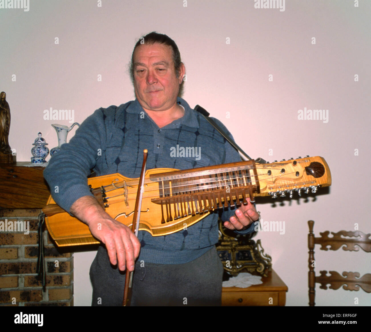 Musician playing a nyckelharpa, a traditional Swedish bowed string ...