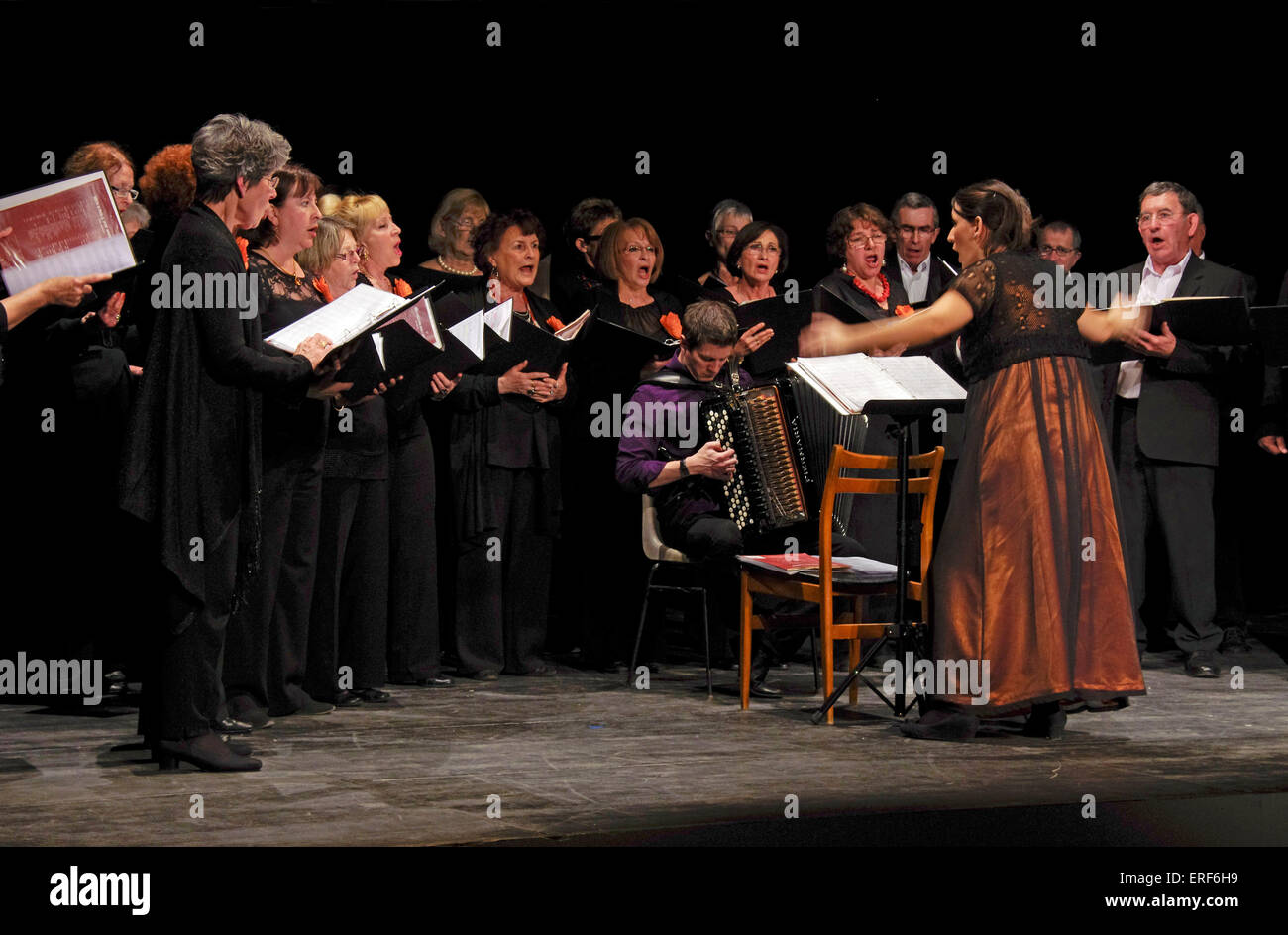 Mixed adult choir with female conductor Stock Photo - Alamy
