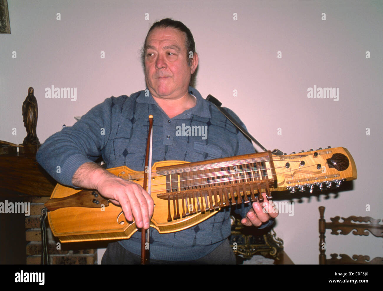 Musician playing a nyckelharpa, a traditional Swedish bowed string ...