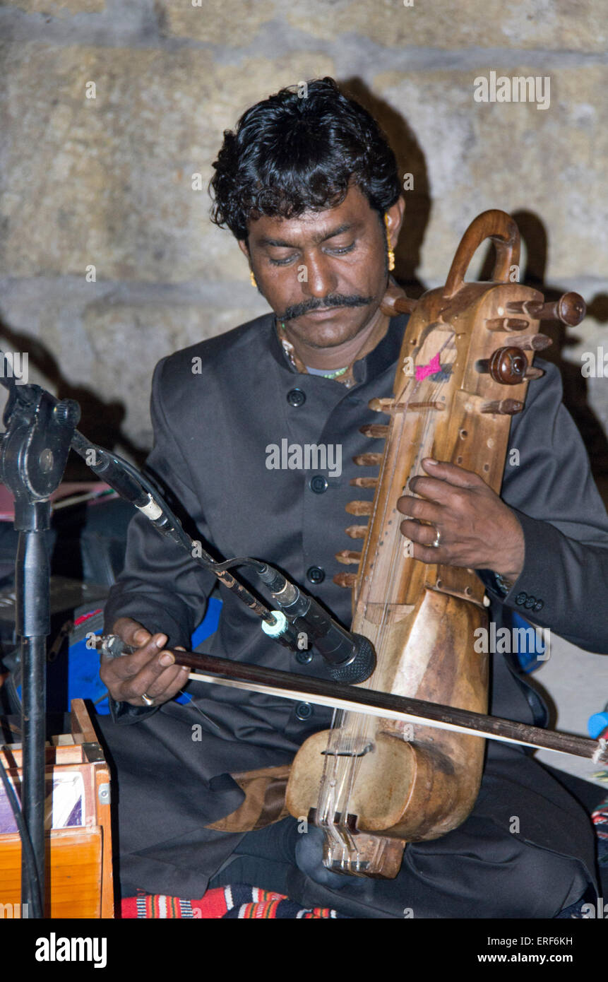 Rajasthani musician Barkat Khan playing a sarangi. The sarangi is the ...