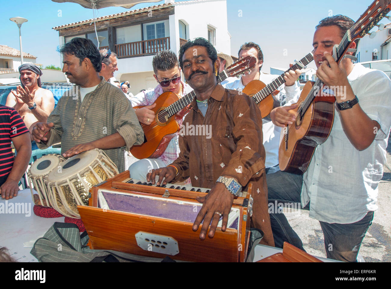 Indian and Gypsy musicians playing and singing together in an impromptu ...