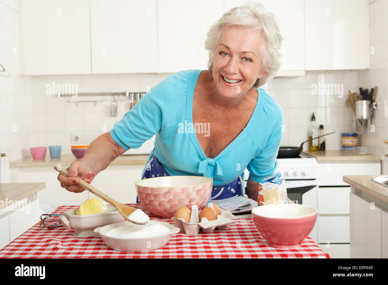 Senior Woman Baking In Kitchen Stock Photo - Alamy