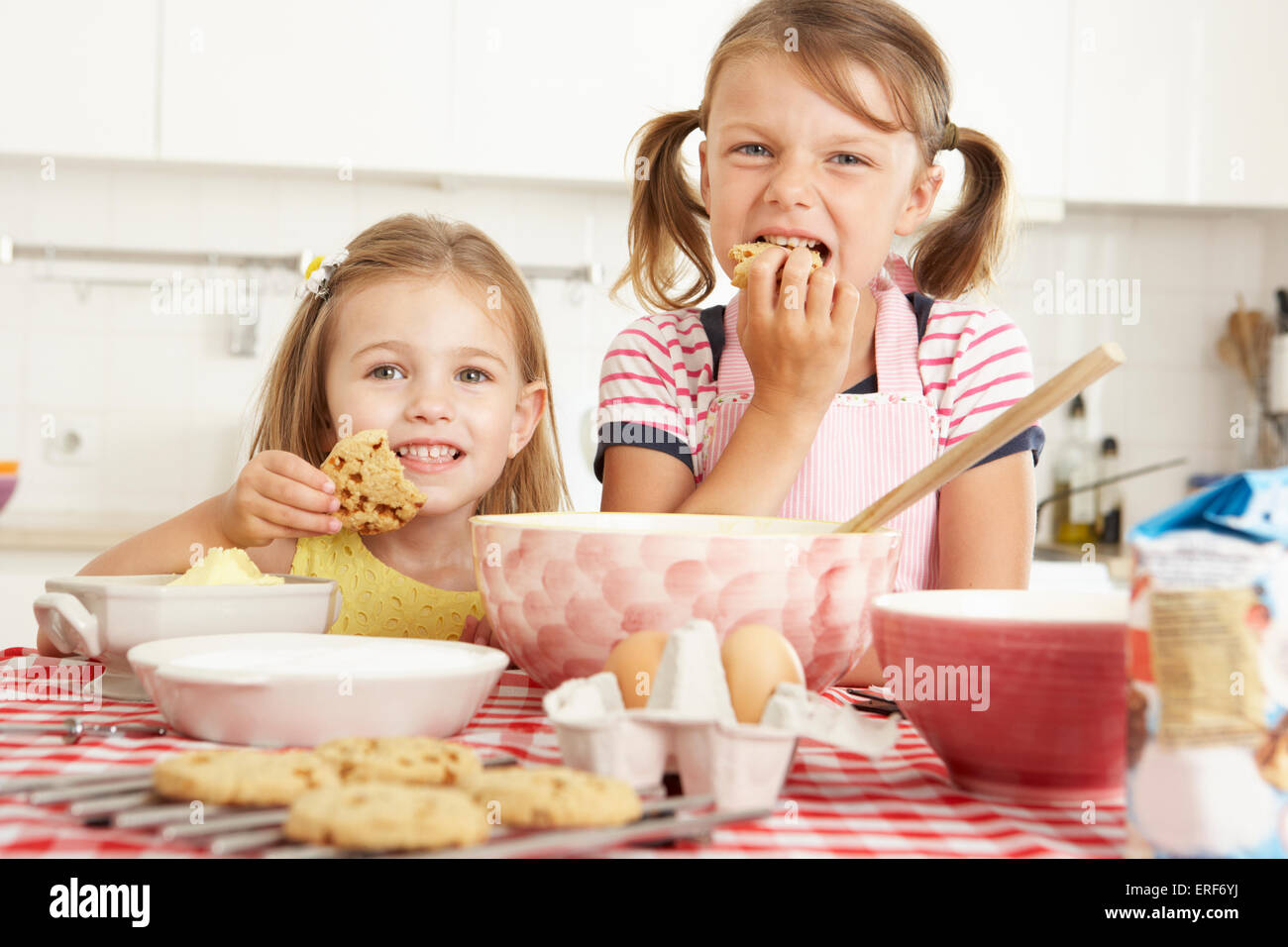 Two Girls Baking In Kitchen Stock Photo - Alamy