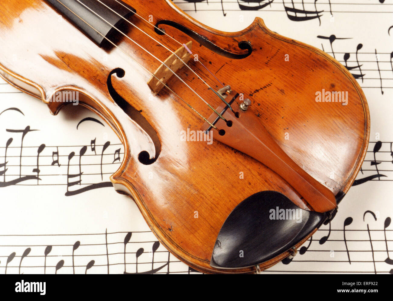 Part of violin laying on printed music score Stock Photo - Alamy