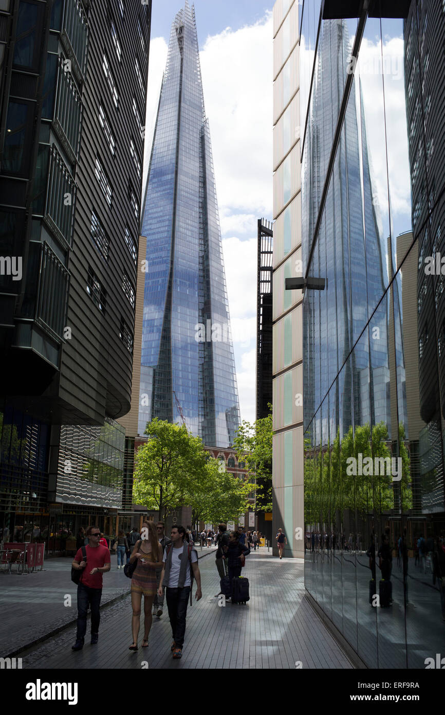The Shard reflected in double against tall buildings at More London, UK ...