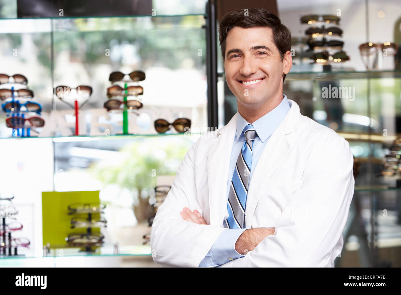Portrait Of Male Optician By Glasses Display Stock Photo - Alamy