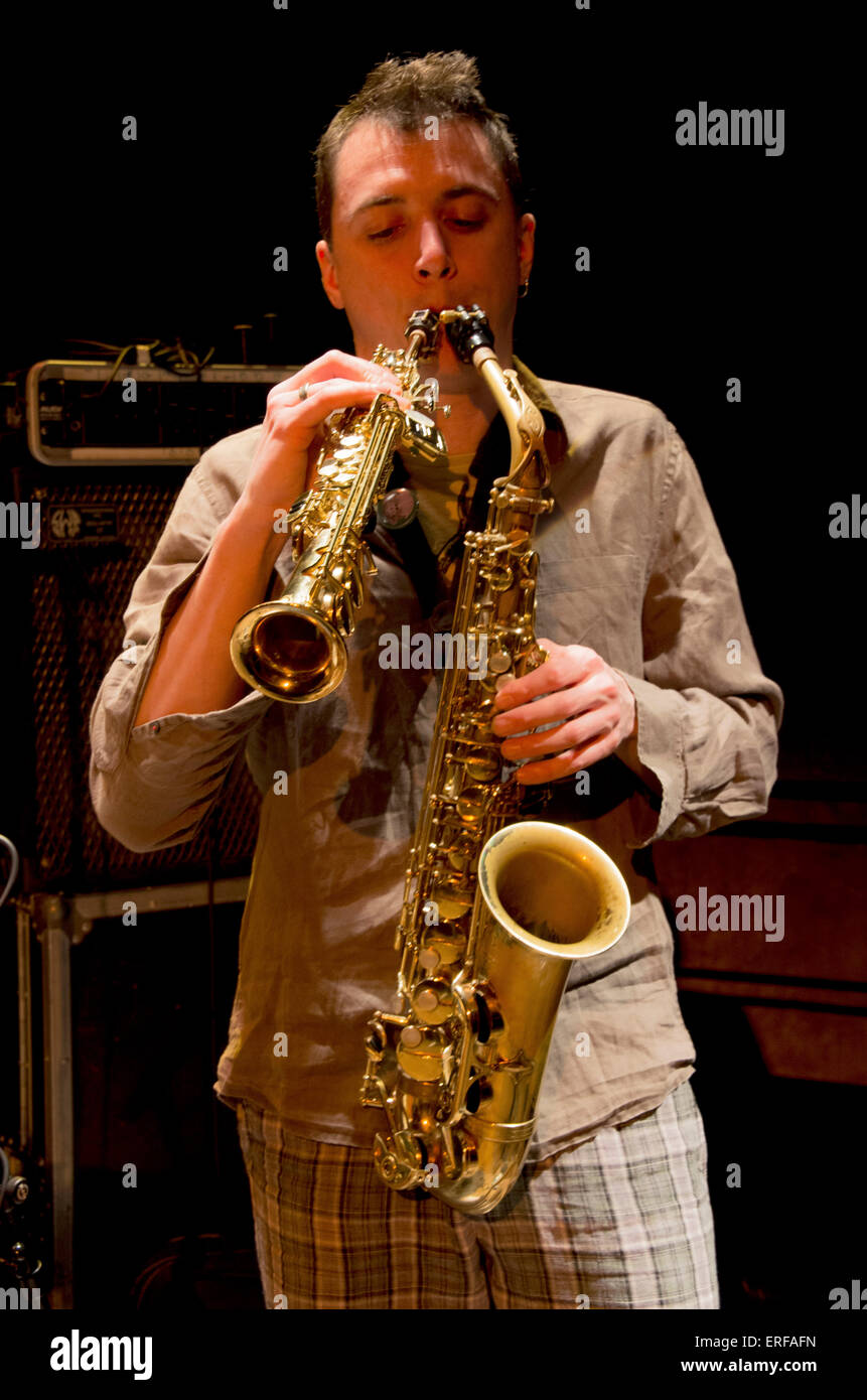 Musician playing soprano and alto saxophones at the same time Stock ...