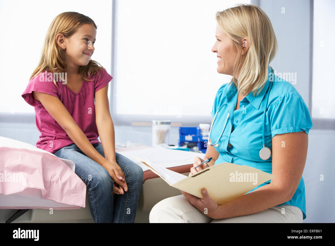 Doctor In Surgery Examining Young Girl Stock Photo - Alamy