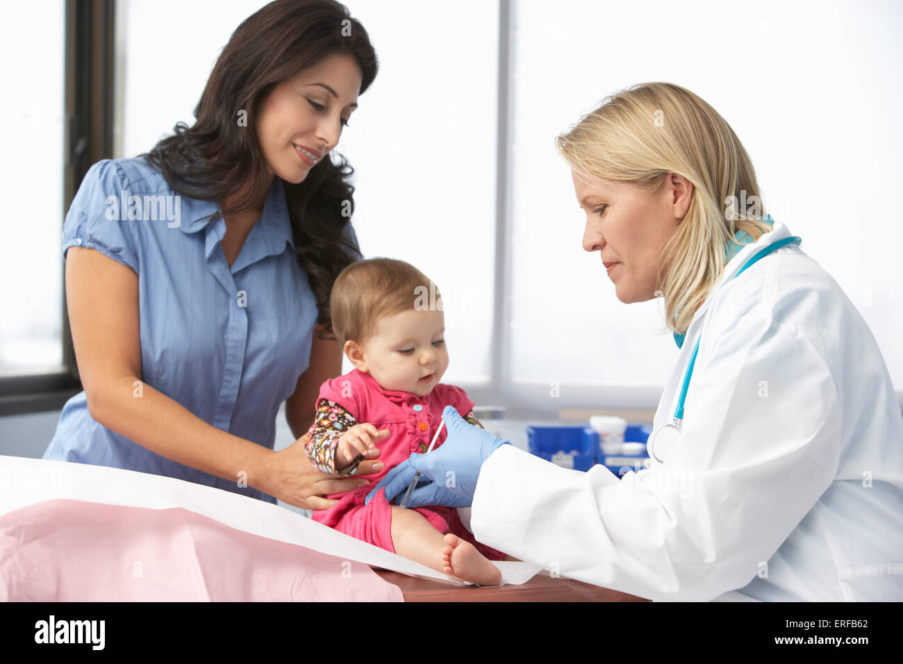 Doctor In Surgery Giving Baby Girl Injection Stock Photo - Alamy