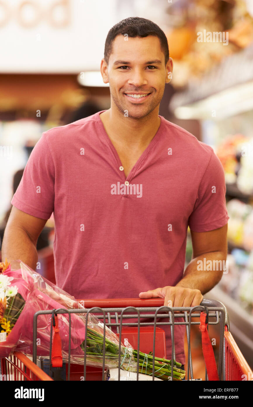 Man Pushing Trolley By Produce Counter In Supermarket Stock Photo - Alamy