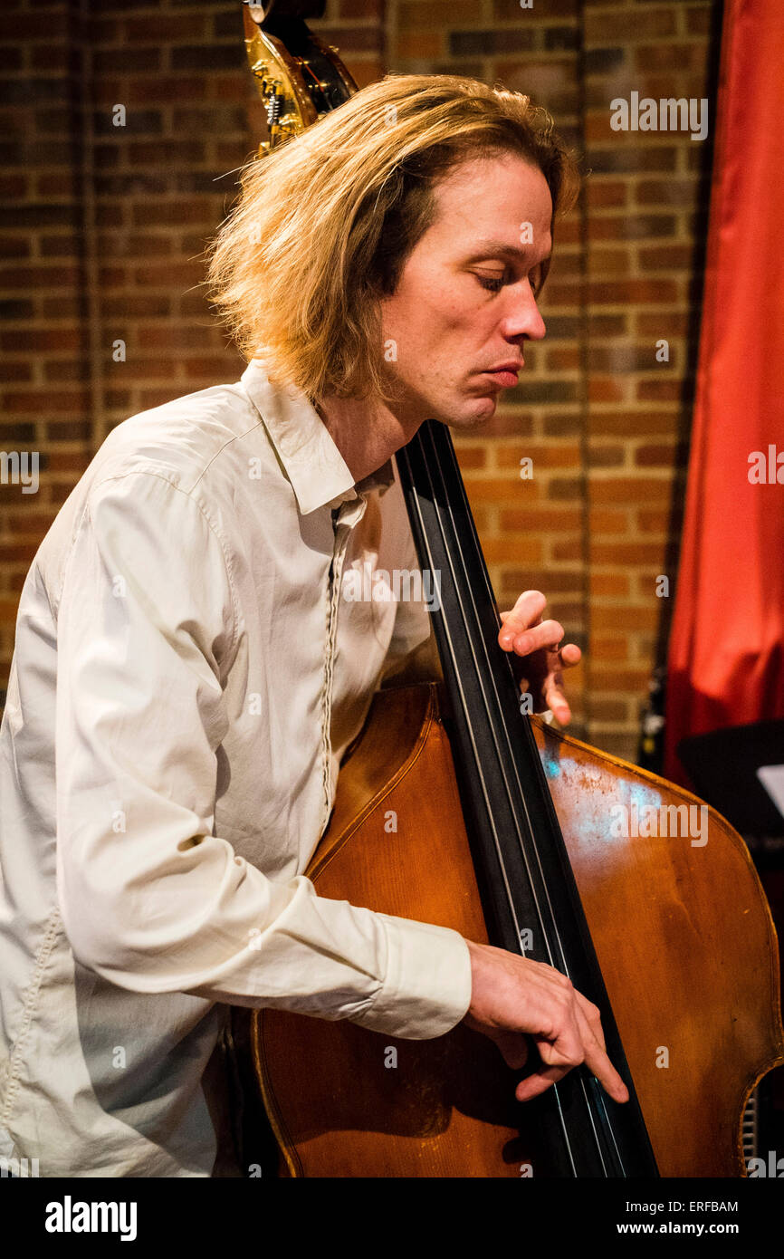 Norwegian bass player Jasper Holby plaing double bass during sound ...