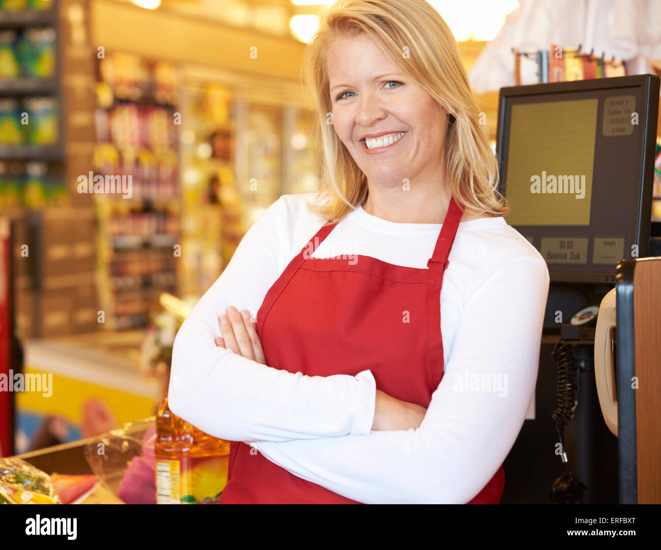 Female Cashier At Supermarket Checkout Stock Photo - Alamy