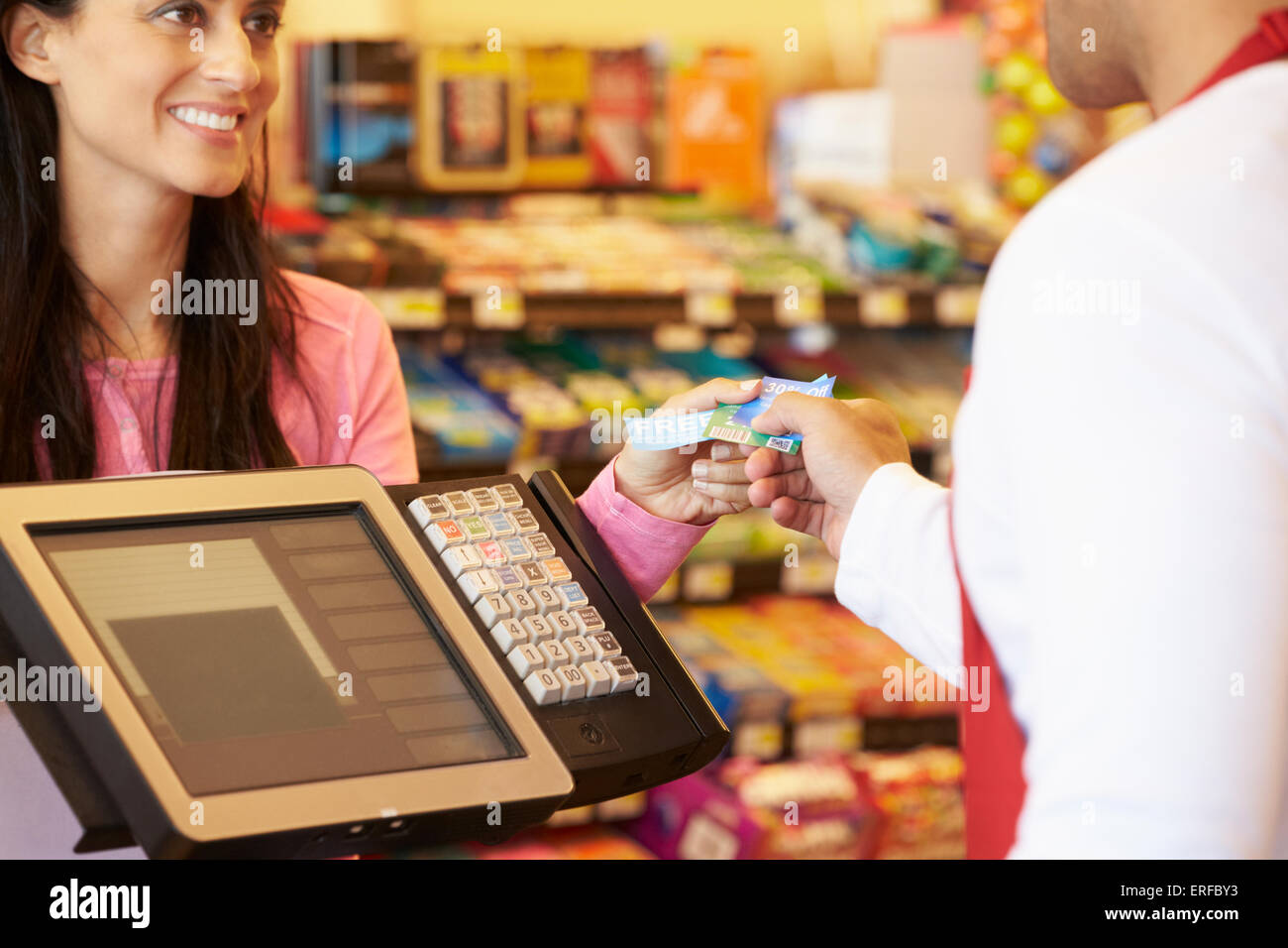 Customer Paying For Shopping At Checkout With Card Stock Photo - Alamy
