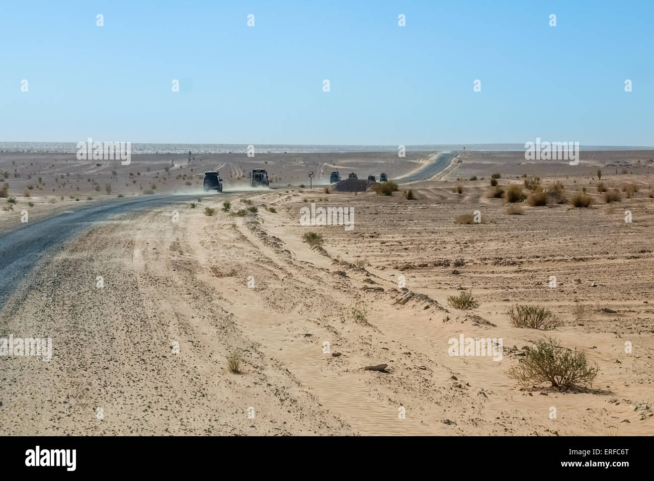 On a paid for guided overland tour a convoy of 4x4 vehicle drive a ...