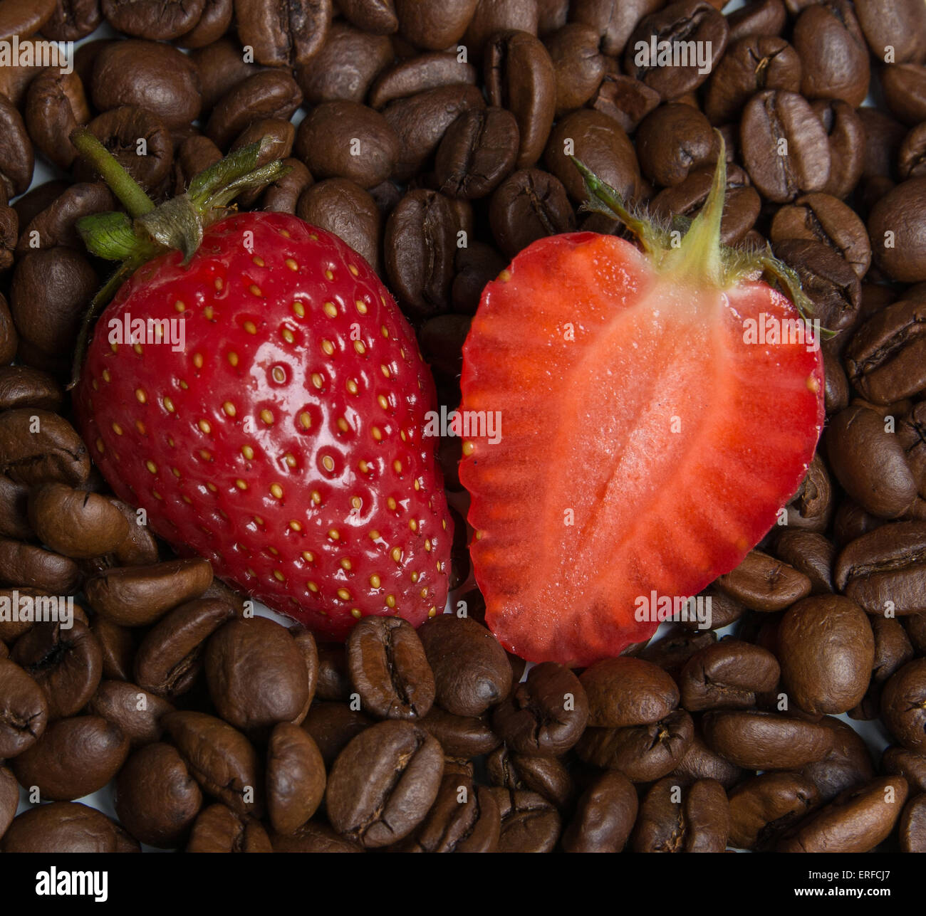red strawberry in coffee beans Stock Photo - Alamy