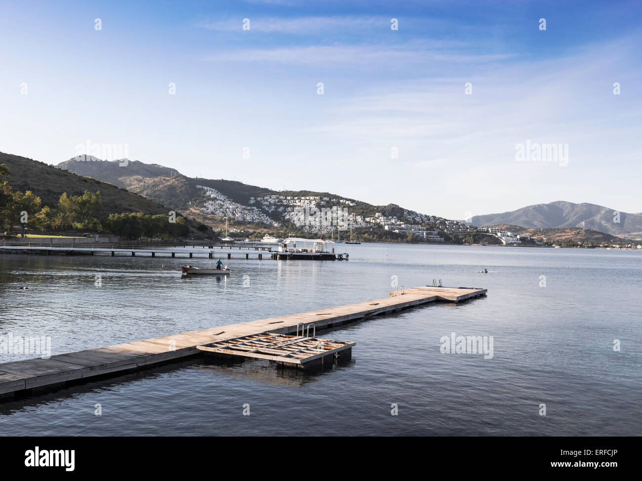 Jetty in the Akyarlar region of Turkey with clear Aegean sea and white ...