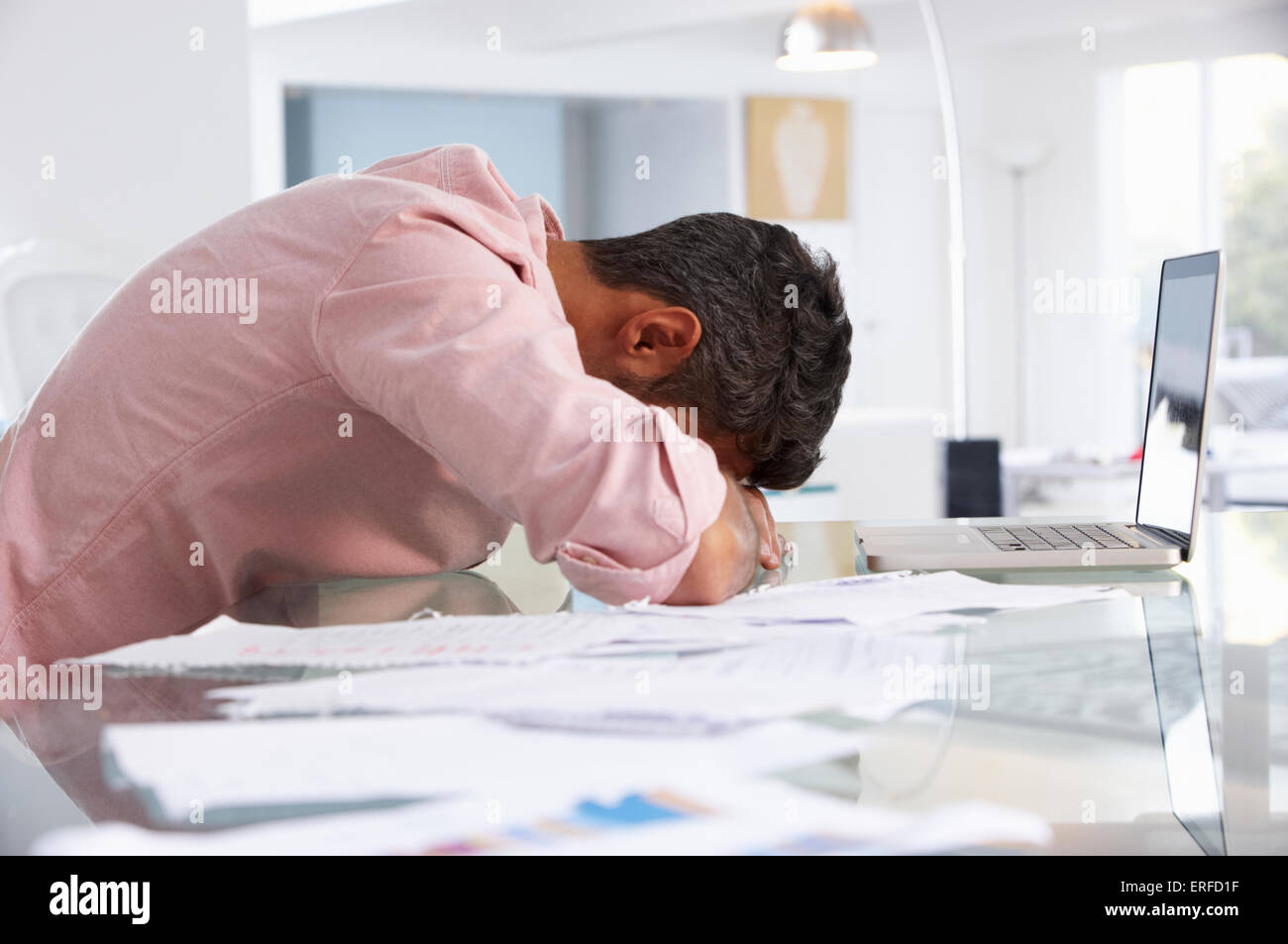 Stressed Man Working At Laptop In Home Office Stock Photo - Alamy