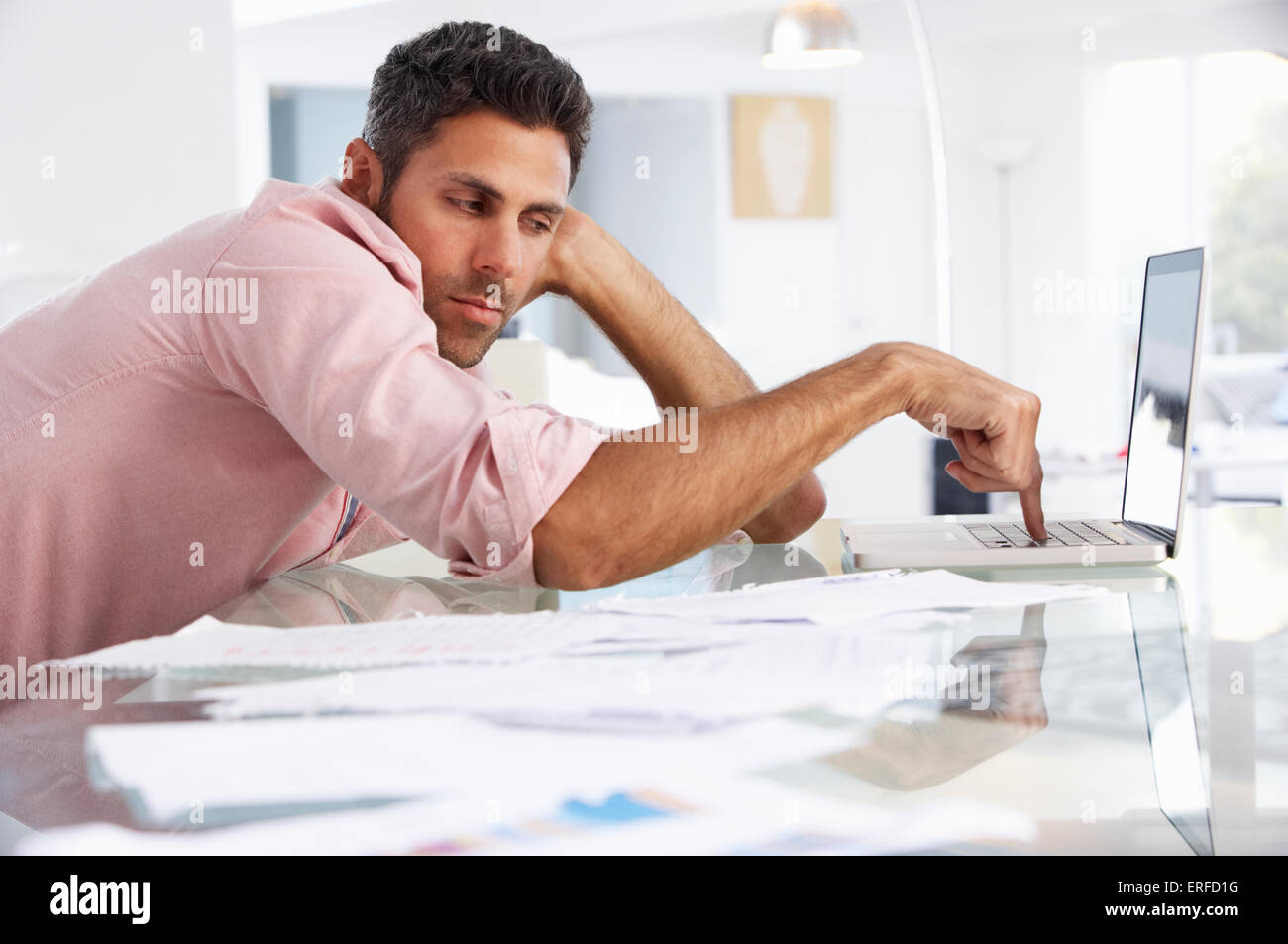 Stressed Man Working At Laptop In Home Office Stock Photo - Alamy