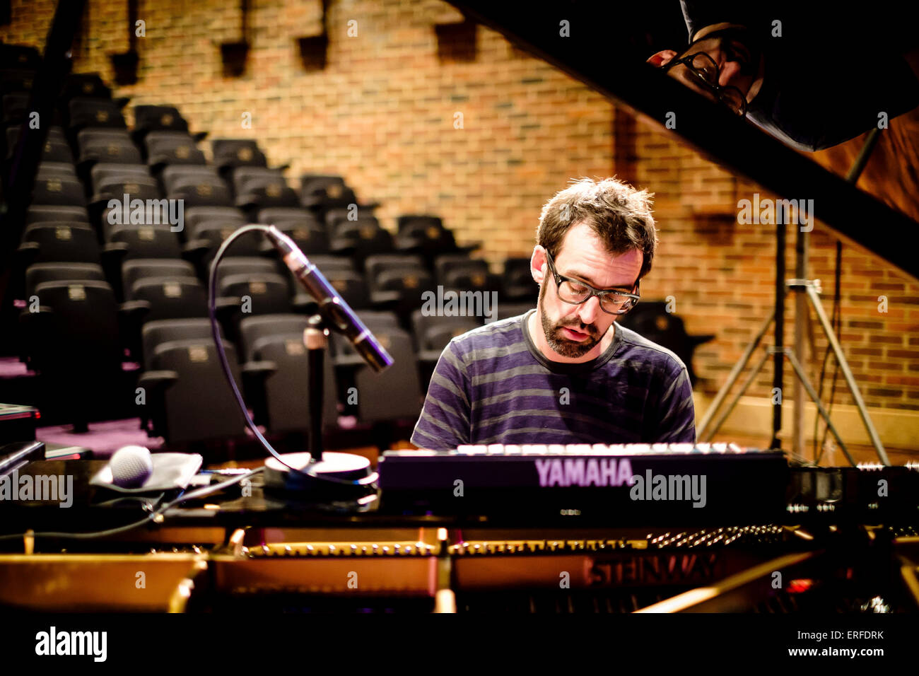 Neil Cowley playing piano during soundchecks at the Turner Sims Concert ...