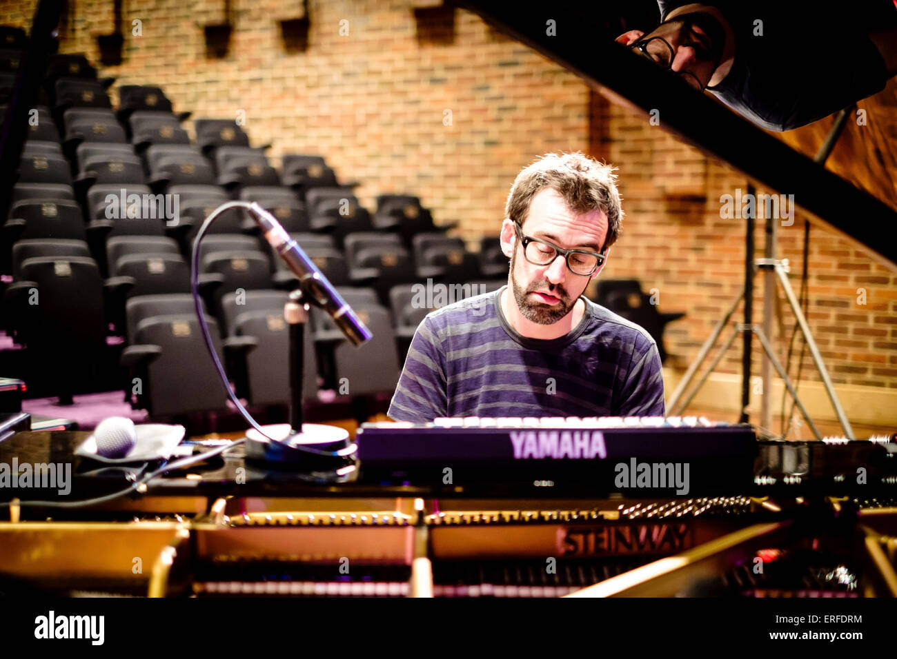 Neil Cowley playing piano during soundchecks at the Turner Sims Concert ...