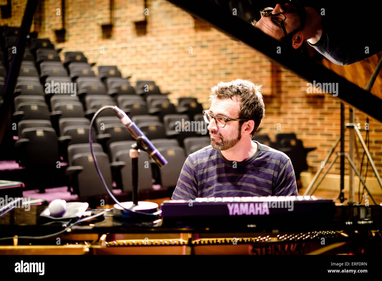 Neil Cowley playing piano during soundchecks at the Turner Sims Concert ...