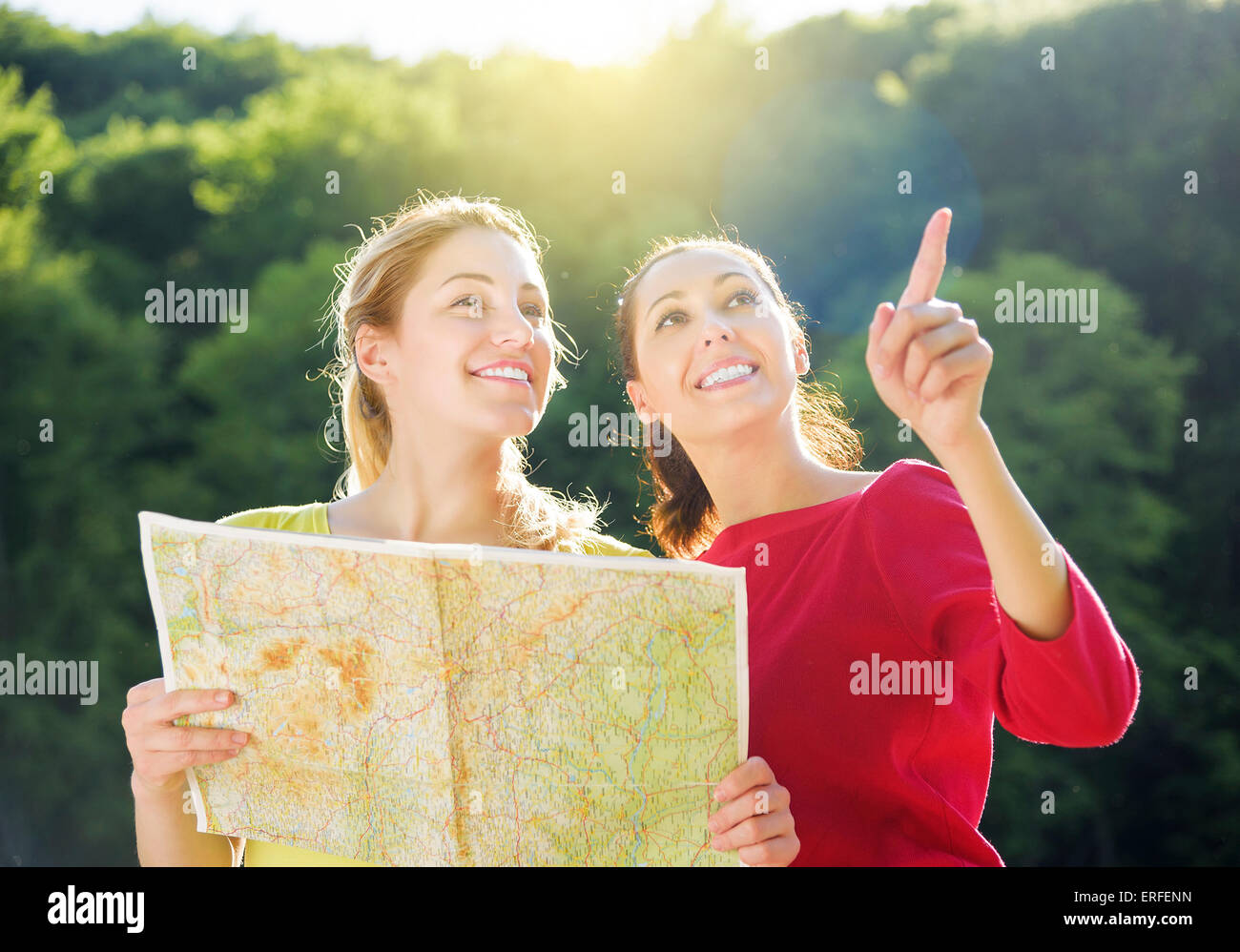 Girls with map Stock Photo - Alamy