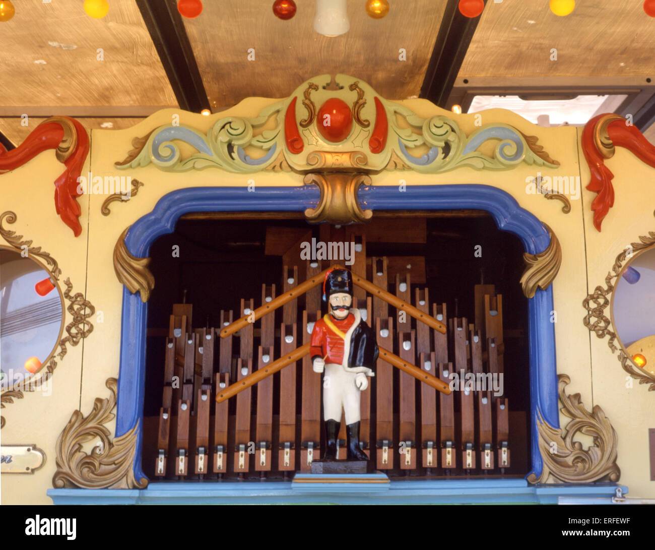 Decorated 31-note keyless organ with wooden figures in folk costumes ...