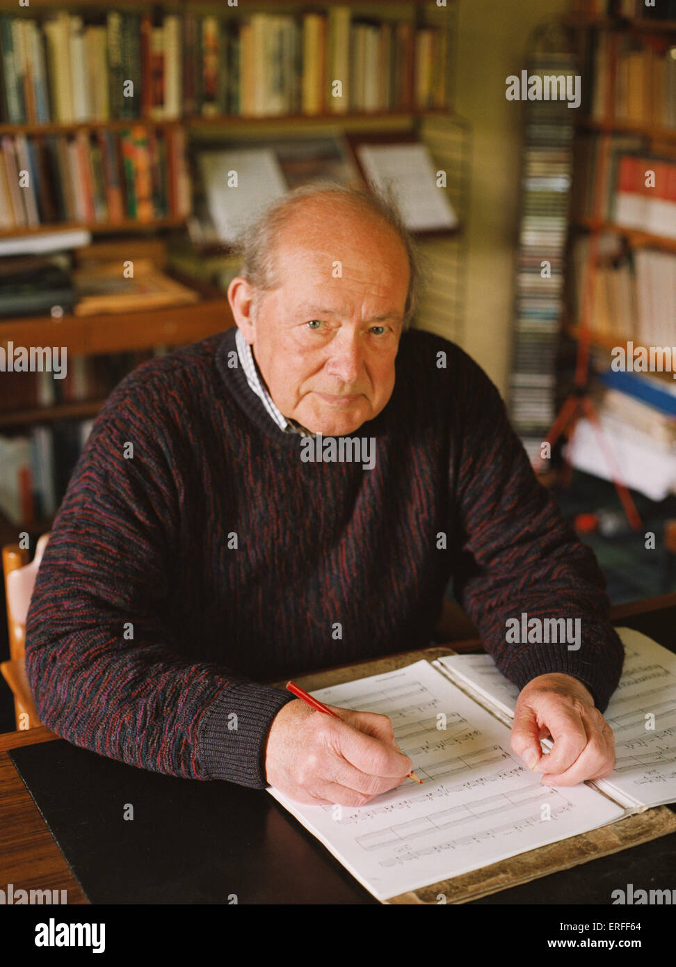 Alun Hoddinott on his 75th birthday, seated with score in study. Welsh ...