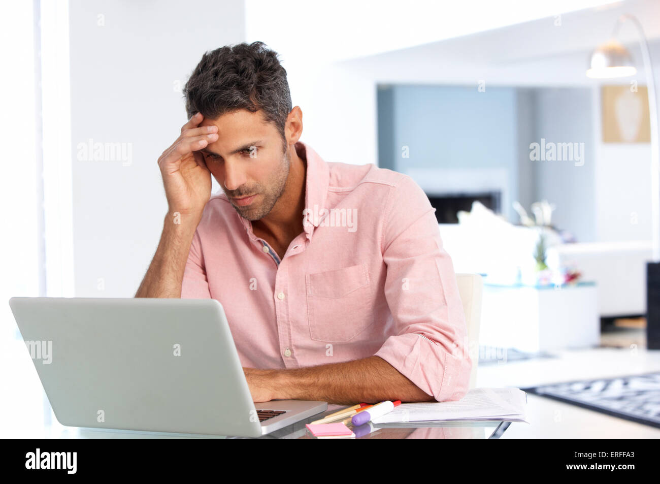 Stressed Man Working At Laptop In Home Office Stock Photo - Alamy