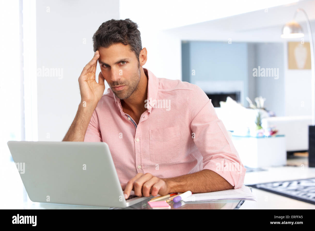 Stressed Man Working At Laptop In Home Office Stock Photo - Alamy