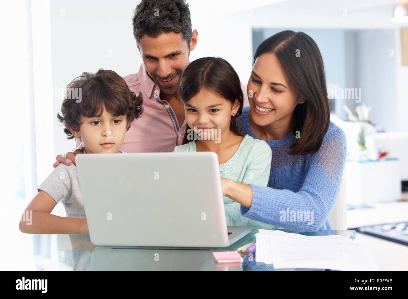 Family Working At Laptop With In Home Office Stock Photo - Alamy
