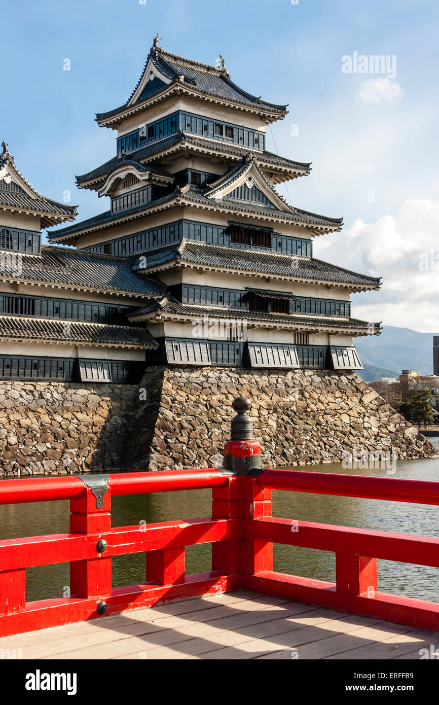 Daytime, a vermilion wooden footbridge with turns, spanning the wide ...