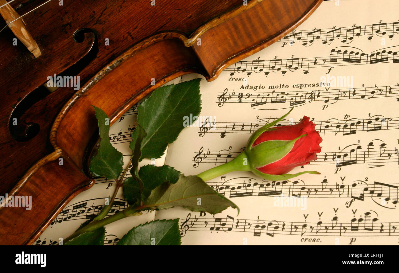 Violin with score and rose Stock Photo - Alamy