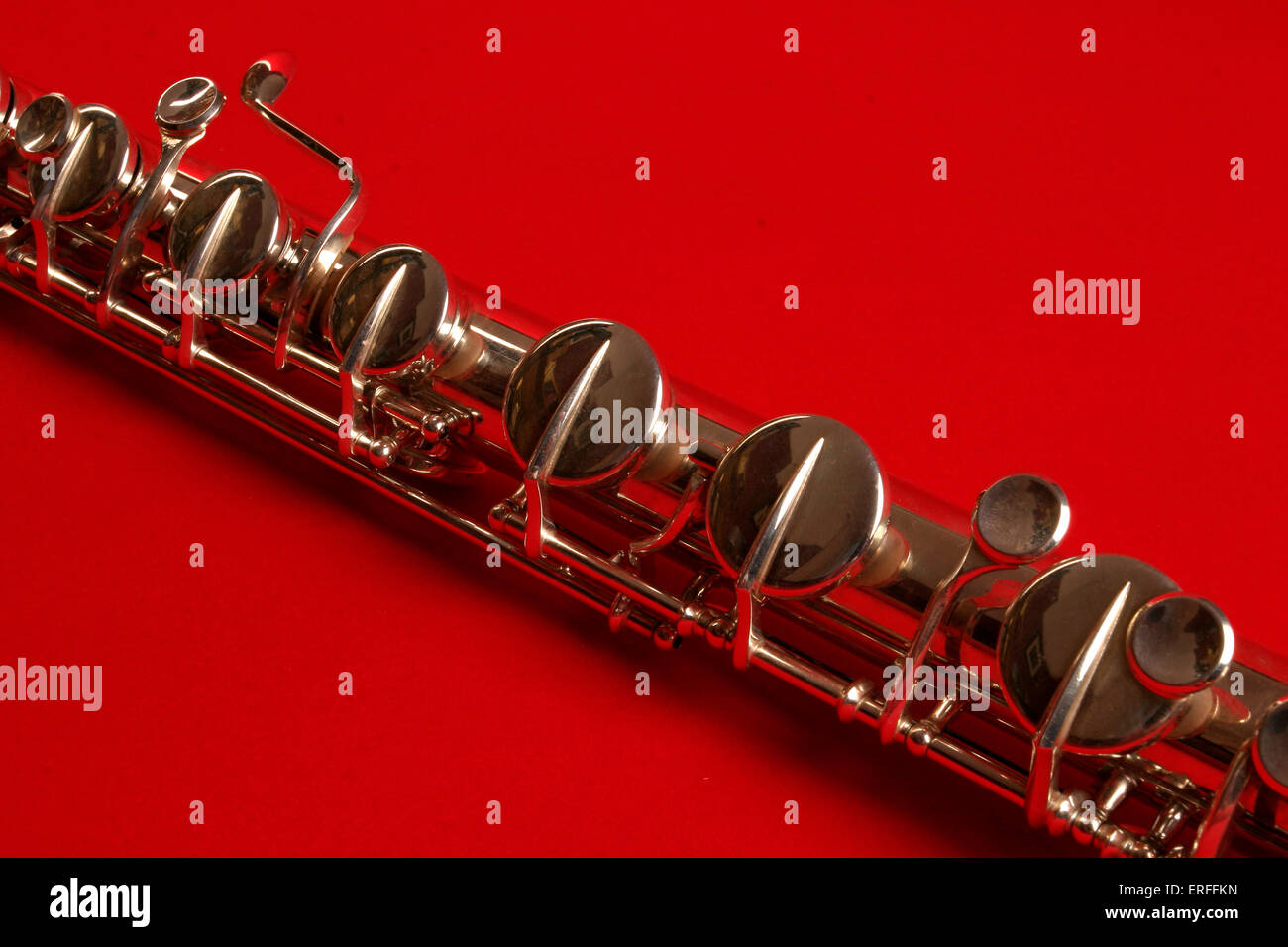 Bass flute, close-up of keys Red background Stock Photo - Alamy