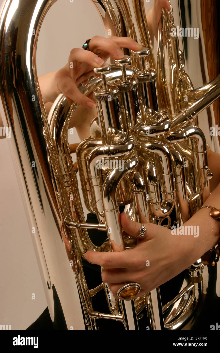Tuba - close up of valves - woman playing demonstrating, practising ...