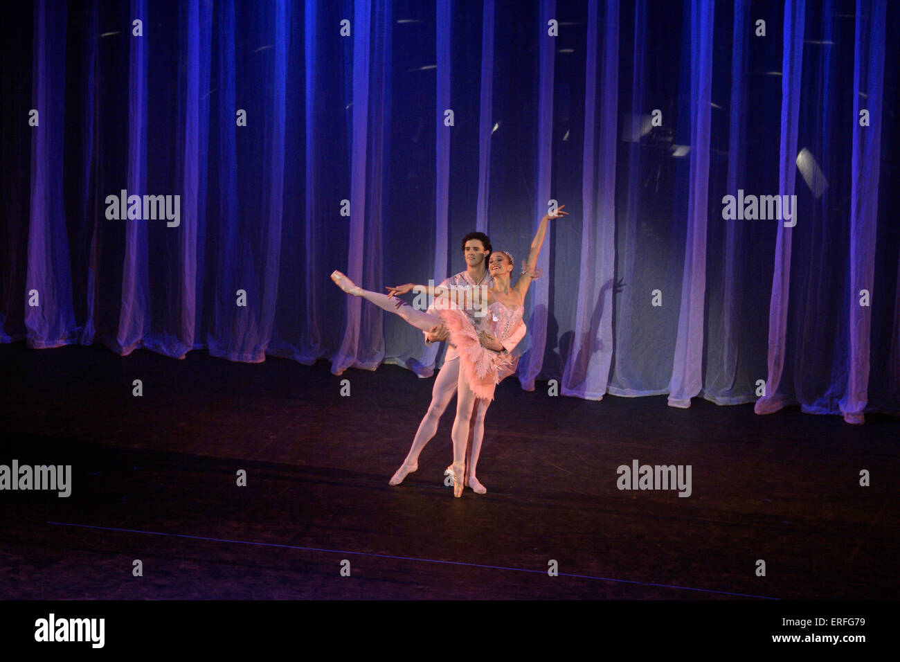 Ballet dancers dancing against backdrop of curtains. from Birmingham ...