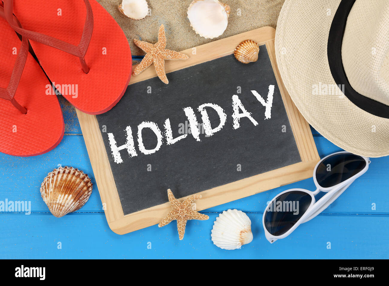 Holiday on the beach in summer with sea shells, sunglasses and hat ...