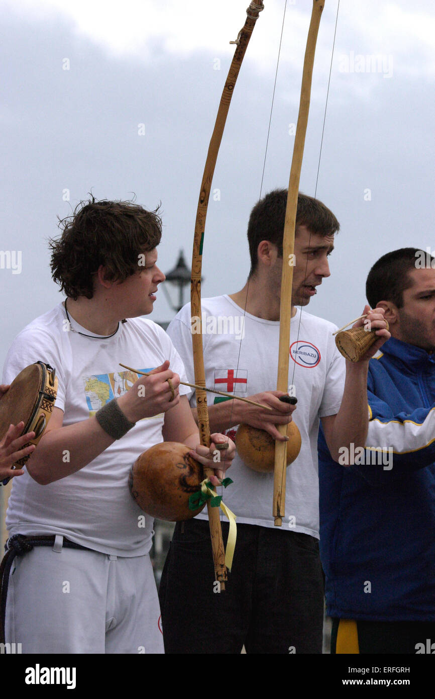 Berimbau - the Brazilian single string instrument being played with a ...
