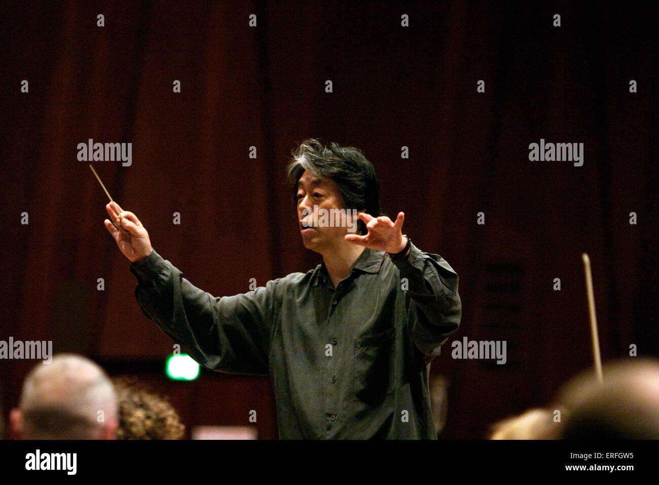 Takuo Yuasa conducting with baton. Japanese conductor Stock Photo - Alamy