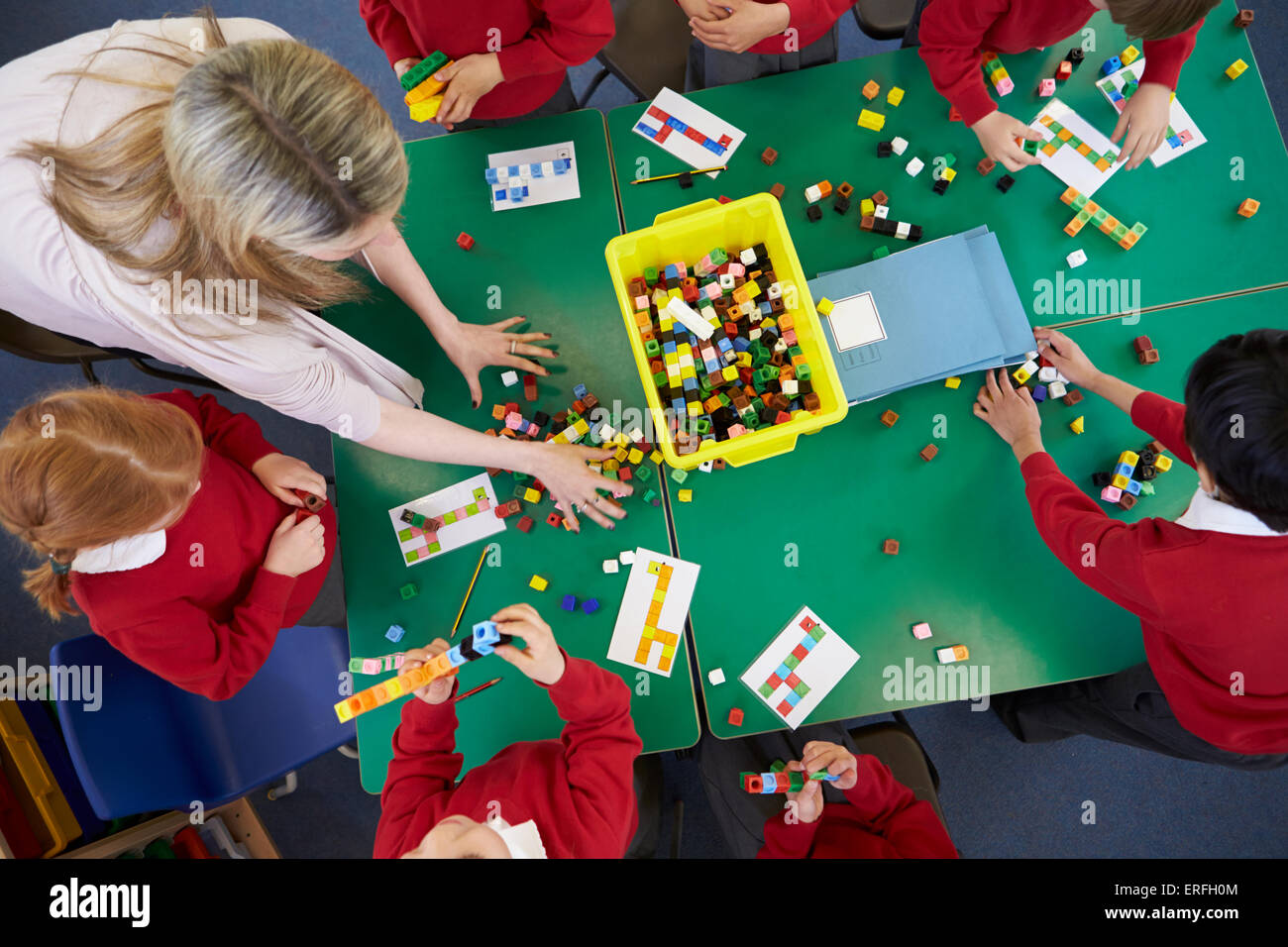 Overhead View Of Pupils And Teacher Working With Blocks Stock Photo - Alamy