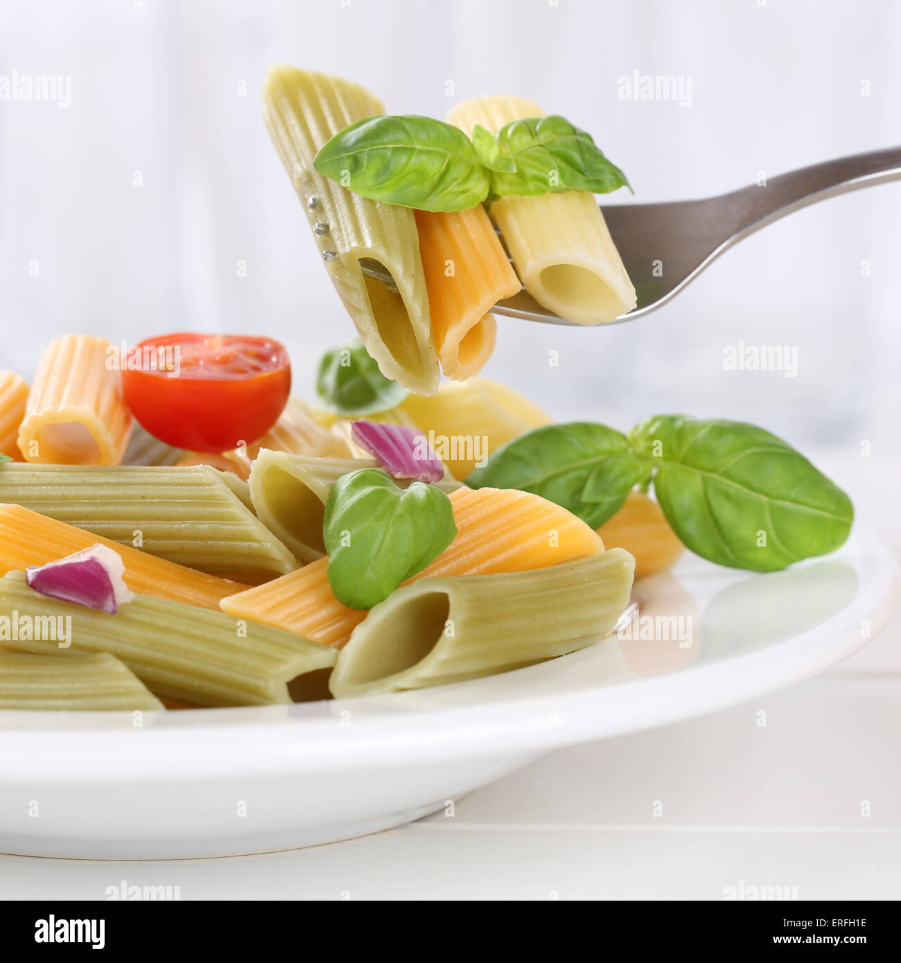 Italian cuisine eating colorful Penne Rigate noodles pasta meal with ...