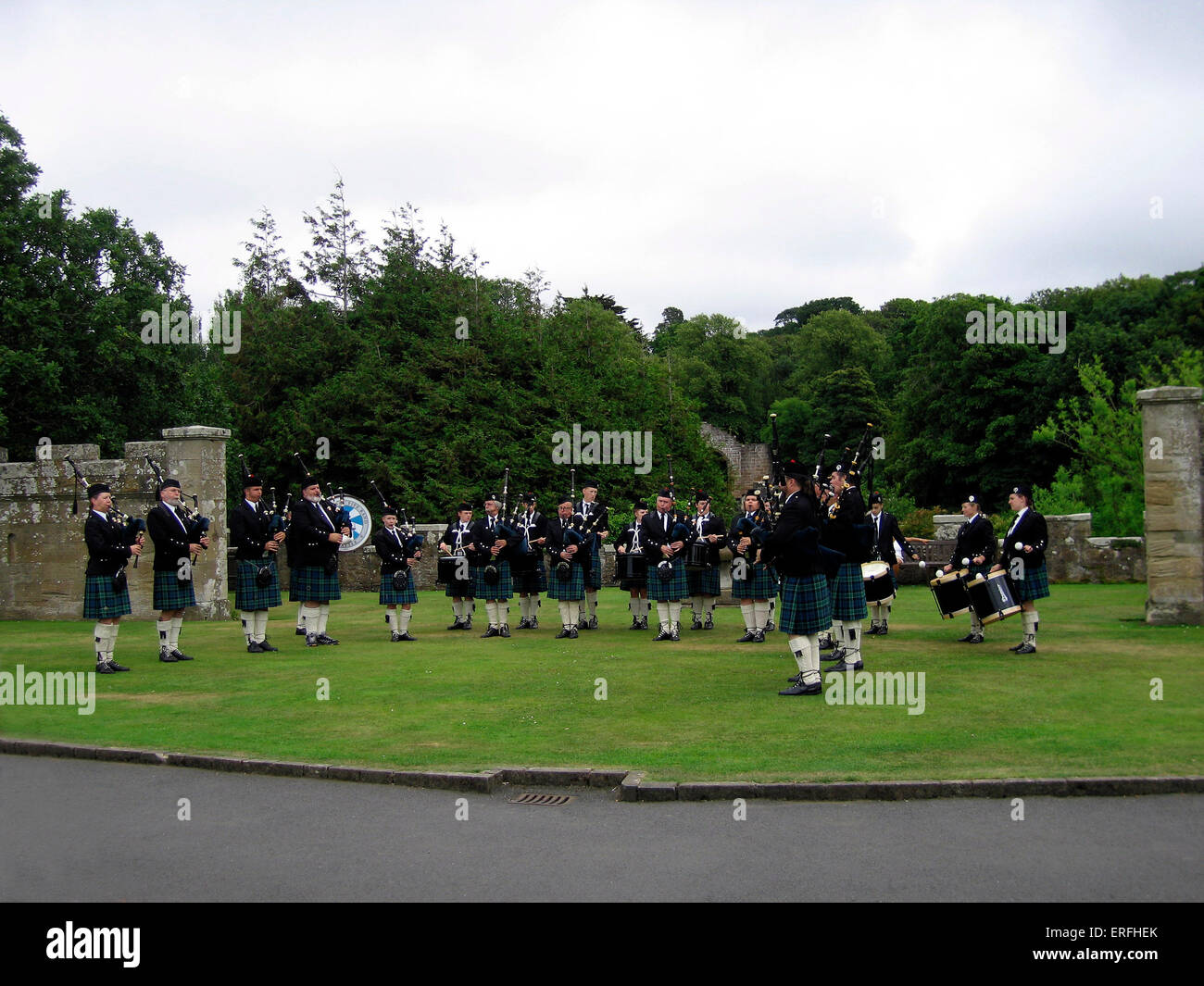 Scottish Pipe Band - a band performing outdoors, playing bagpipes and ...