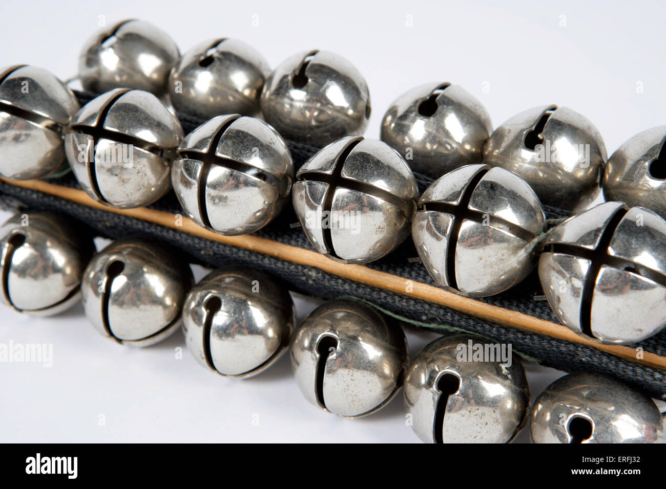 Sleigh bells set on a post. White background Stock Photo - Alamy