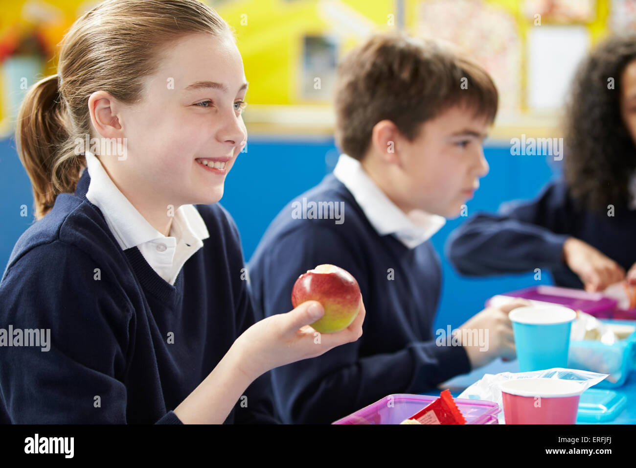 Schoolchildren Sitting At Table Eating Packed Lunch Stock Photo - Alamy