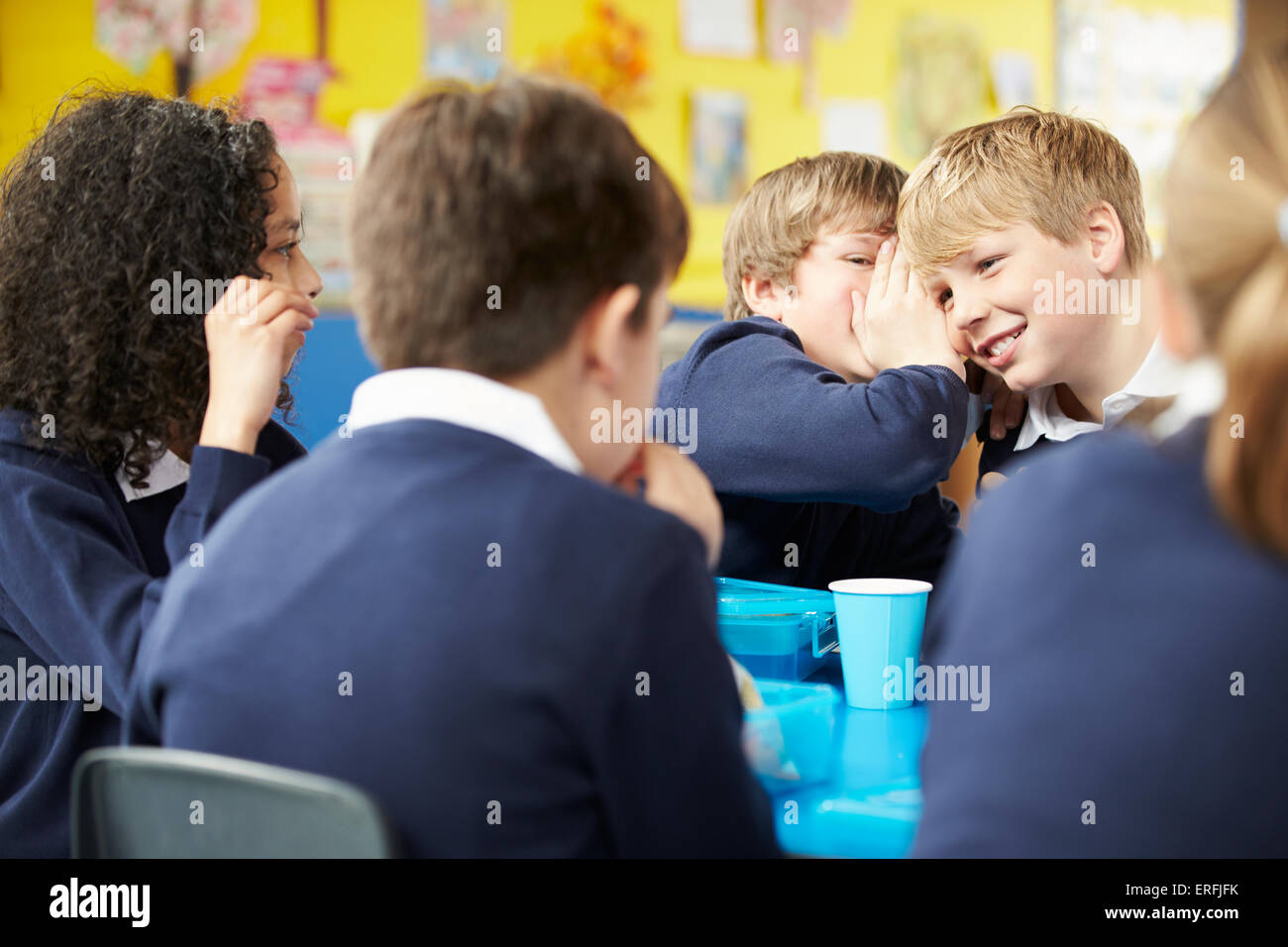 Schoolchildren Sitting At Table Eating Packed Lunch Stock Photo - Alamy