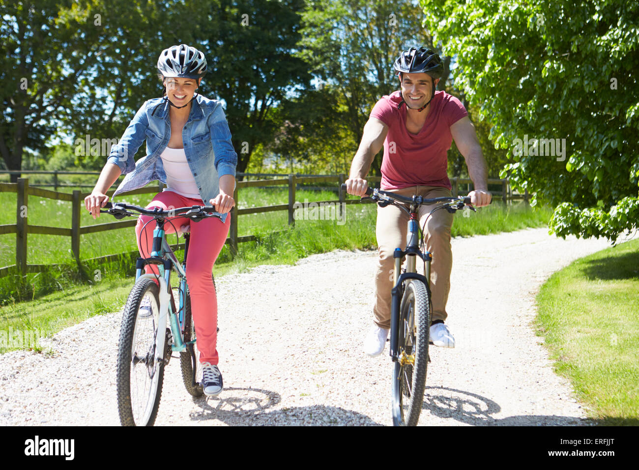 Young Couple On Cycle Ride In Countryside Stock Photo - Alamy