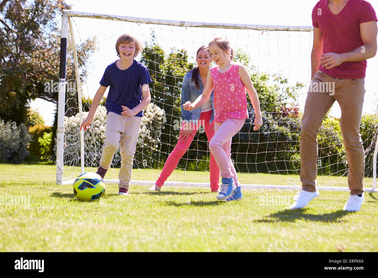 Family Playing Football Together Stock Photo - Alamy
