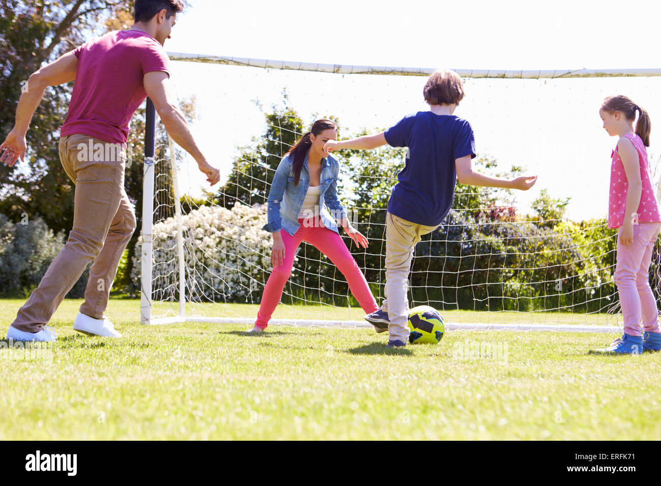 Family Playing Football Together Stock Photo - Alamy