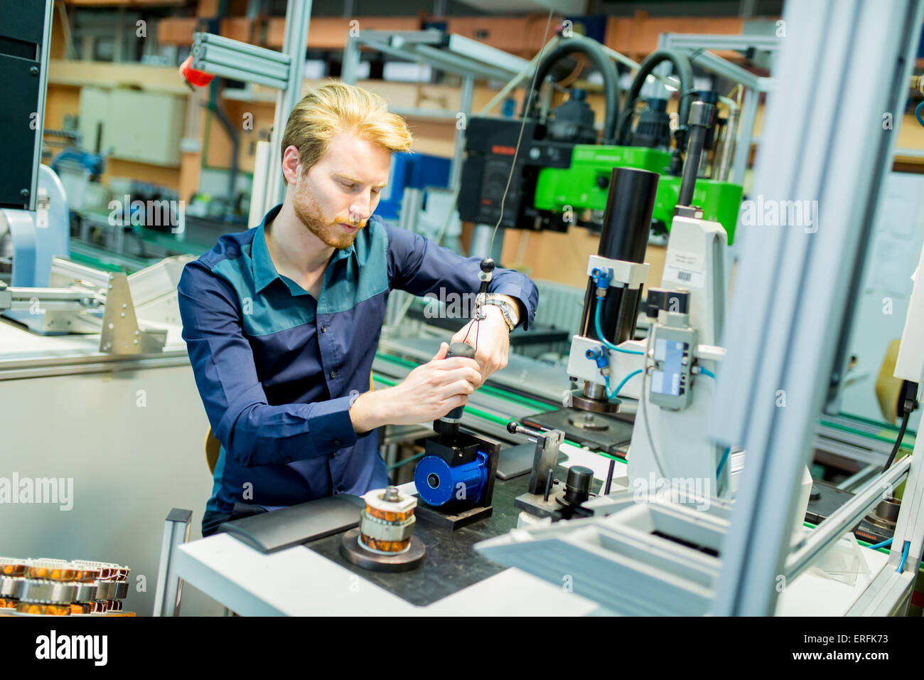 Young man in electronics workshop Stock Photo - Alamy