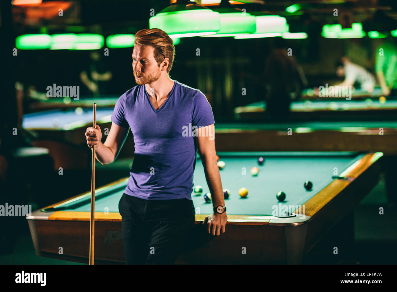 Young man playing pool Stock Photo - Alamy